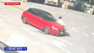 Shocking Road Drama: Woman Clings to Car Bonnet in High-Speed Escape ...